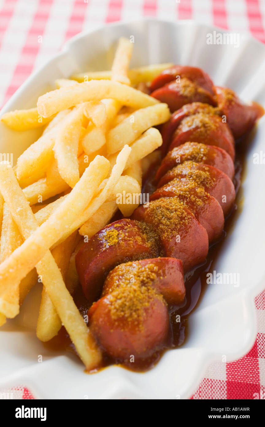 Currywurst sausage with ketchup curry powder and chips FoodCollection ...