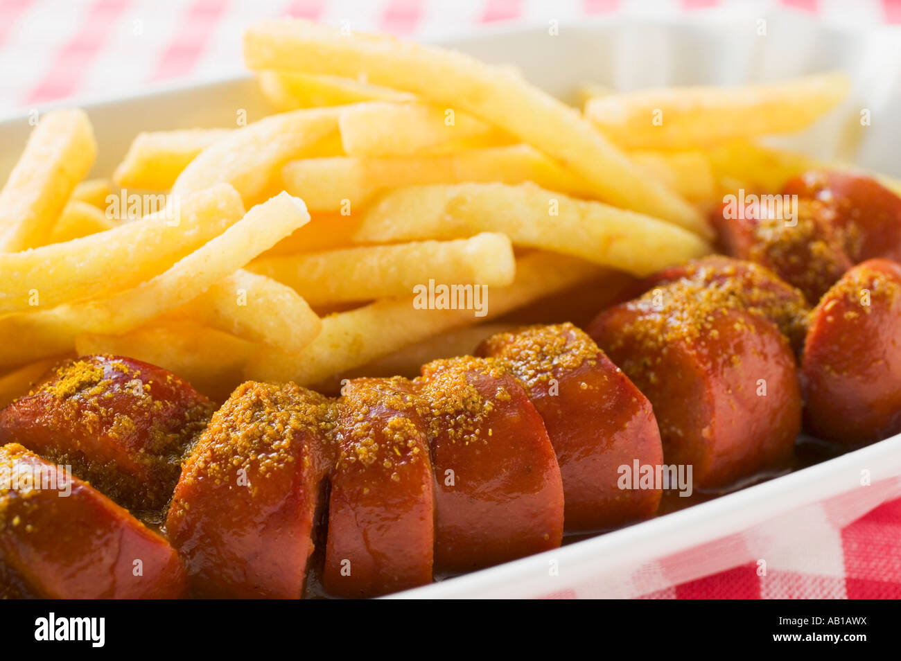 Currywurst sausage with ketchup curry powder and chips FoodCollection ...