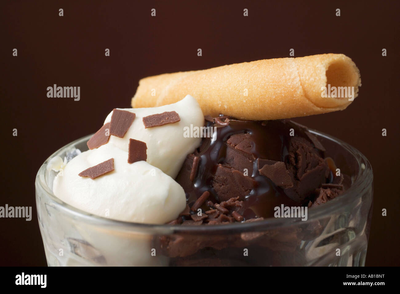 Sundae of chocolate ice cream cream wafer curl close up FoodCollection ...