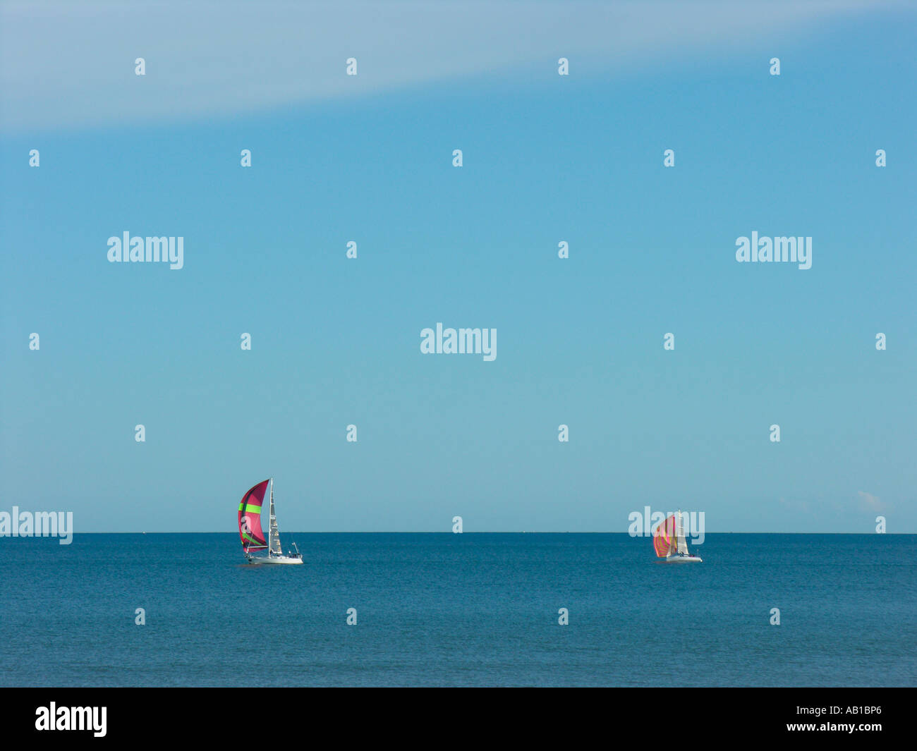 Sailboats racing at sea Stock Photo - Alamy