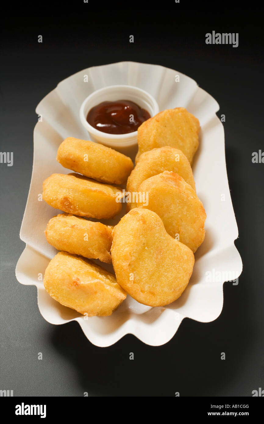 Chicken nuggets with dip in paper dish FoodCollection Stock Photo - Alamy
