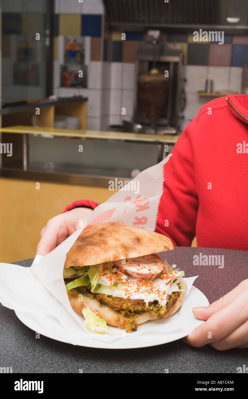 Pita bread filled with falafel in a snack bar FoodCollection Stock ...
