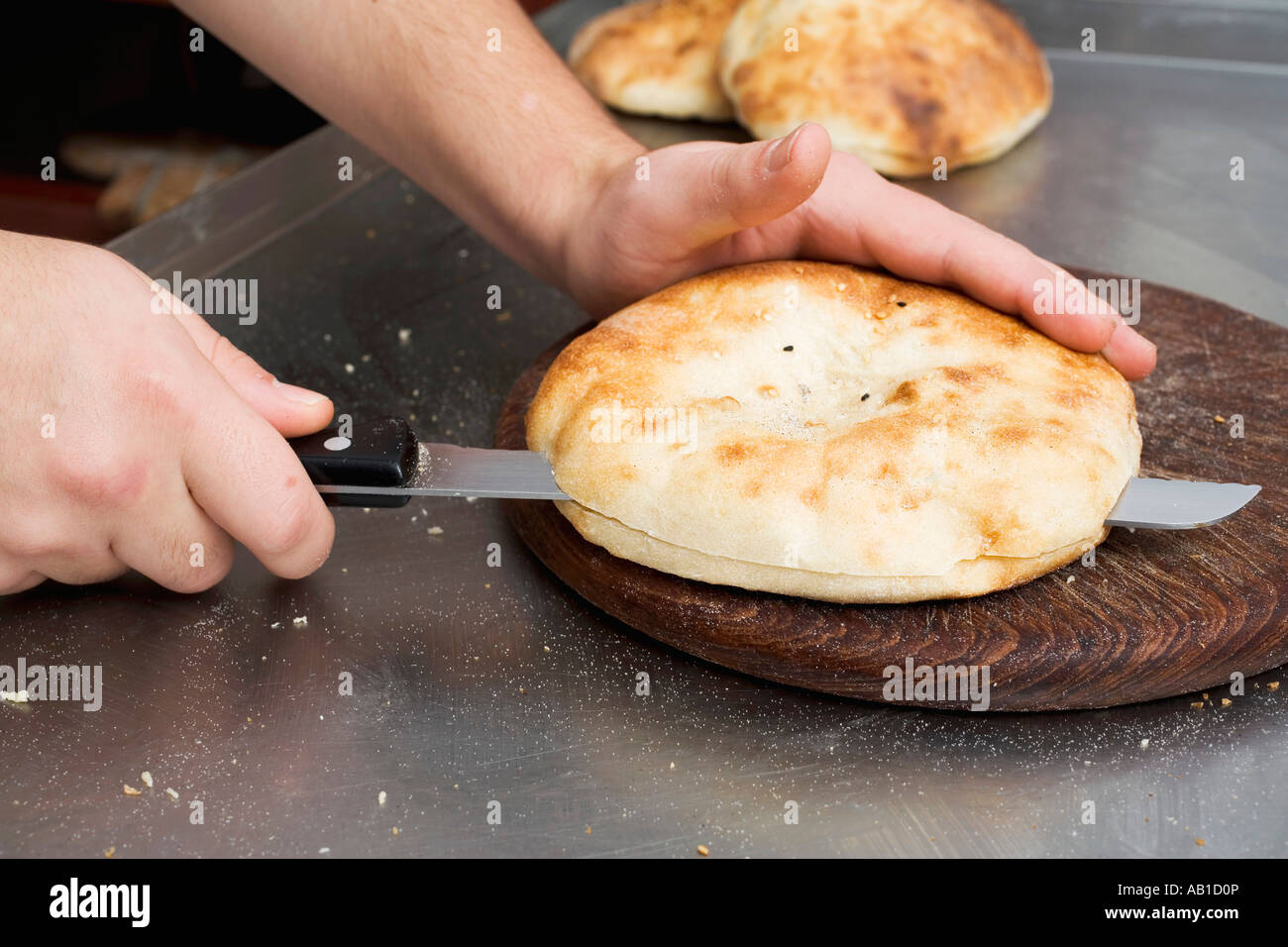 Splitting pita bread FoodCollection Stock Photo - Alamy