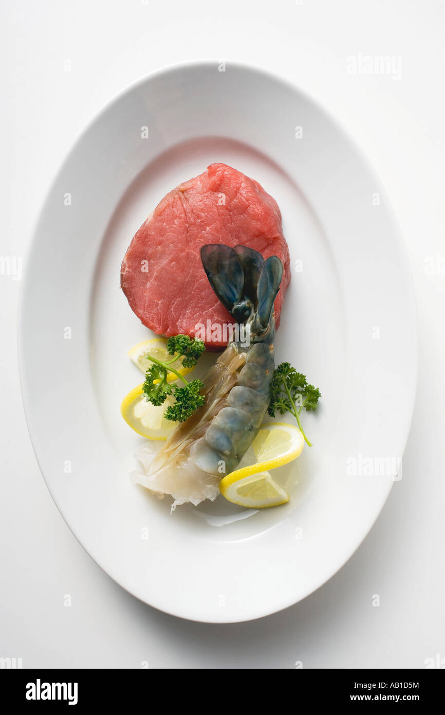 Beef fillet and king prawn with parsley and lemon FoodCollection Stock ...