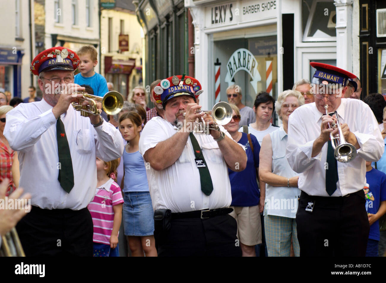 Adamant New Orleans Parade Band march thru the streets of Brecon during ...