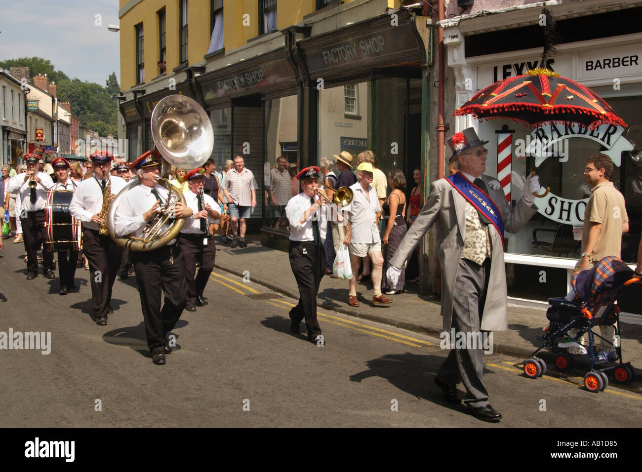 Adamant New Orleans Parade Band march thru the streets of Brecon during ...