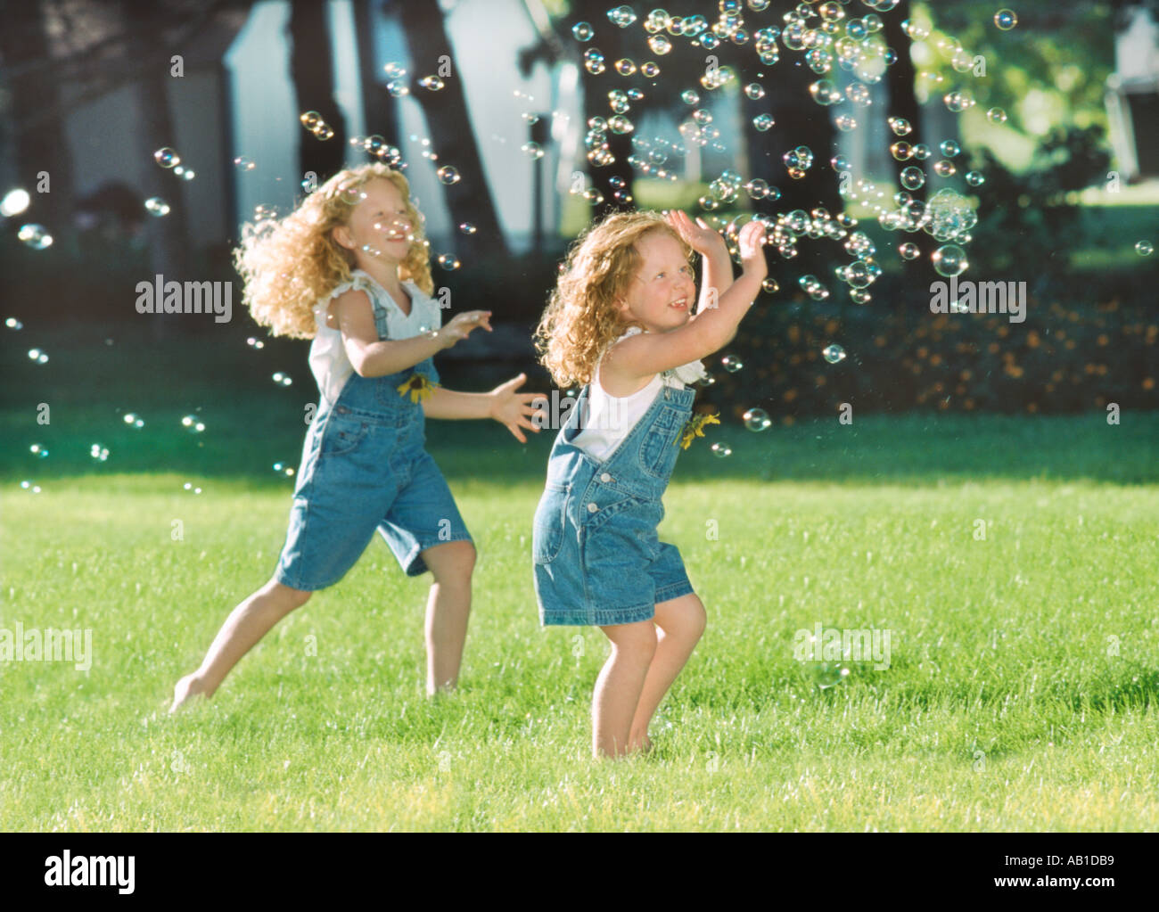 Kids chasing bubbles hi-res stock photography and images - Alamy