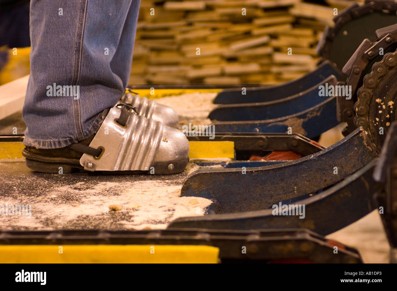 STEEL COVERED BOOTS PROTECT THE FEET OF THE BOARD GRADER Stock Photo ...