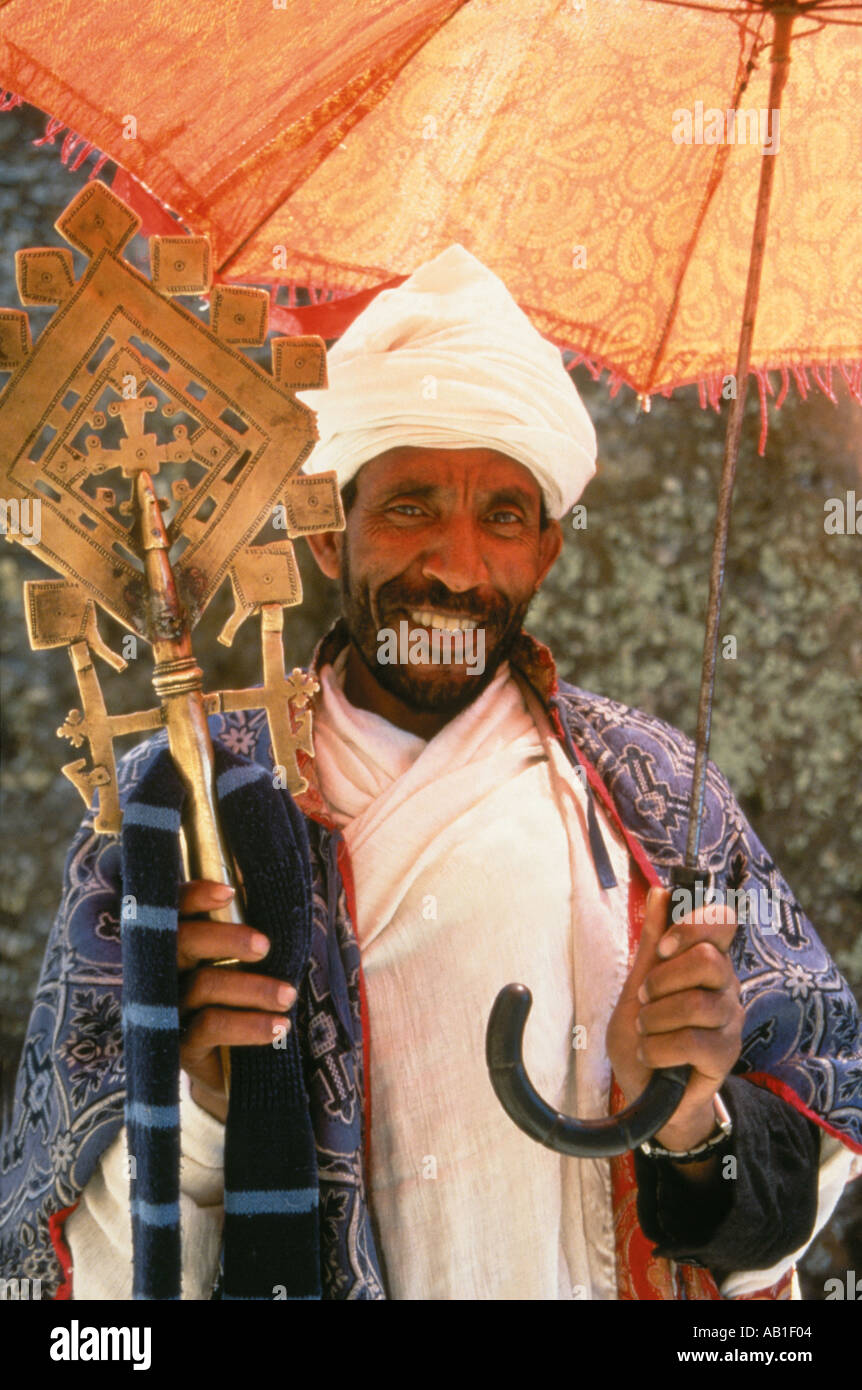 Traditionally Robed Deacon with cross and parasol at Rock -Hewn Coptic ...
