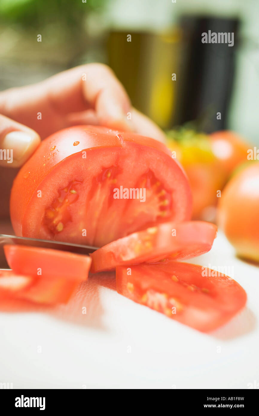 Slicing tomato FoodCollection Stock Photo - Alamy