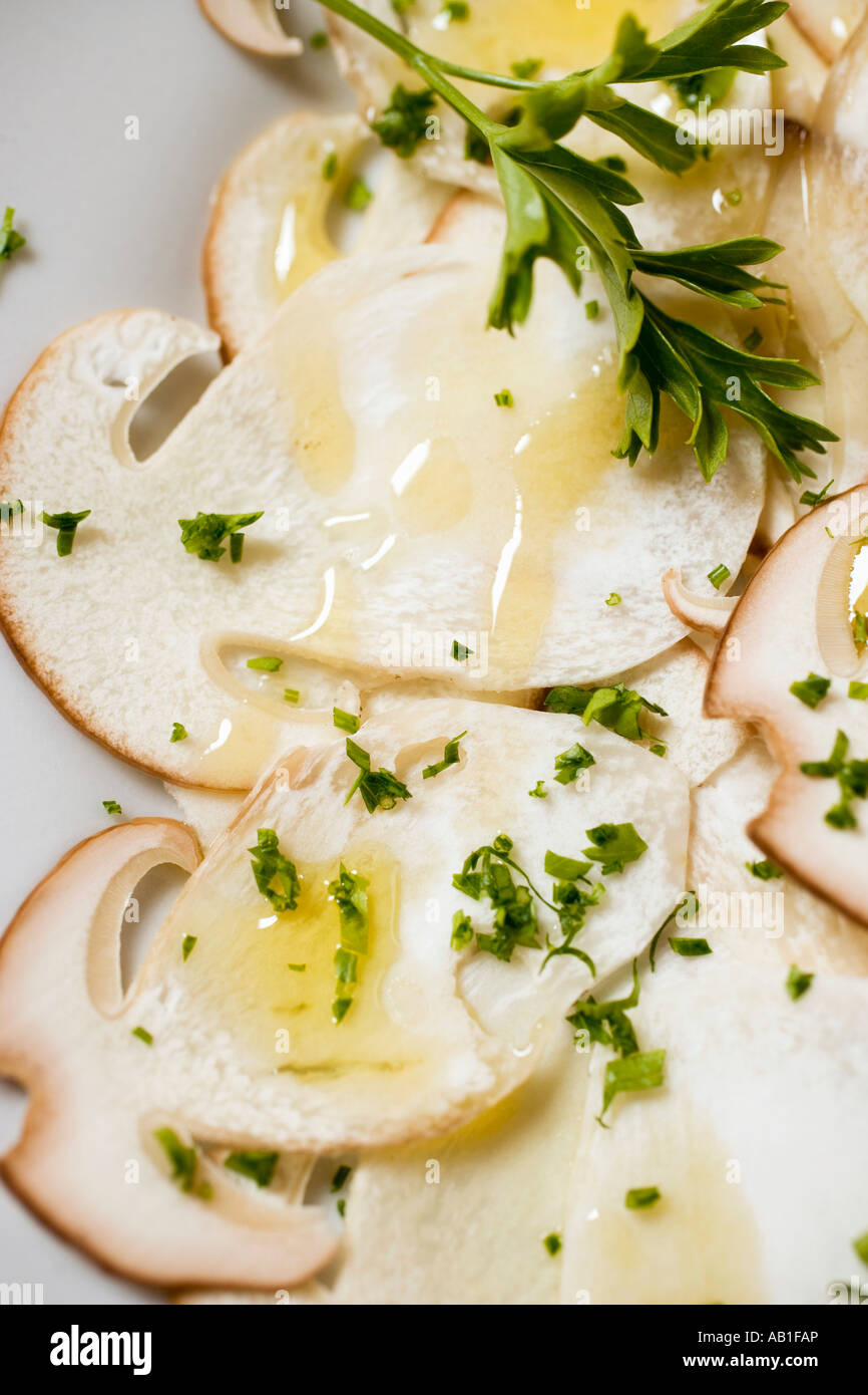 Cep carpaccio with olive oil and herbs close up FoodCollection Stock ...