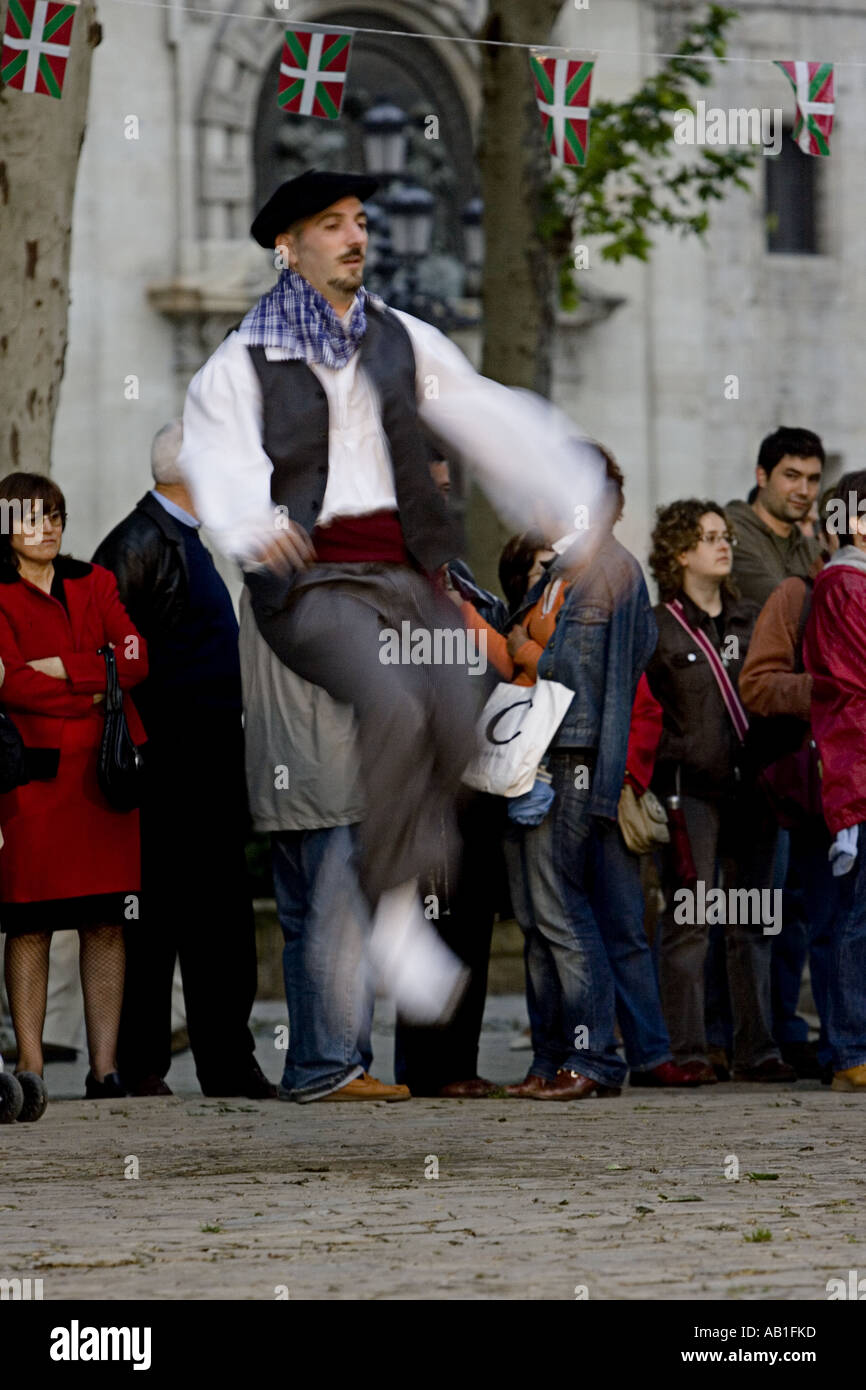 Basque man leaps in air during folk dance in Plaza Arenal, Bilbao Pais ...