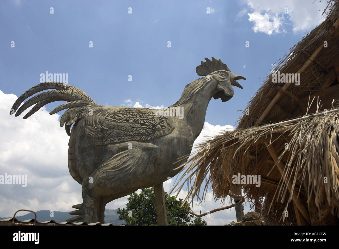 Concrete chicken centrepiece of Koho minority people weaving village ...