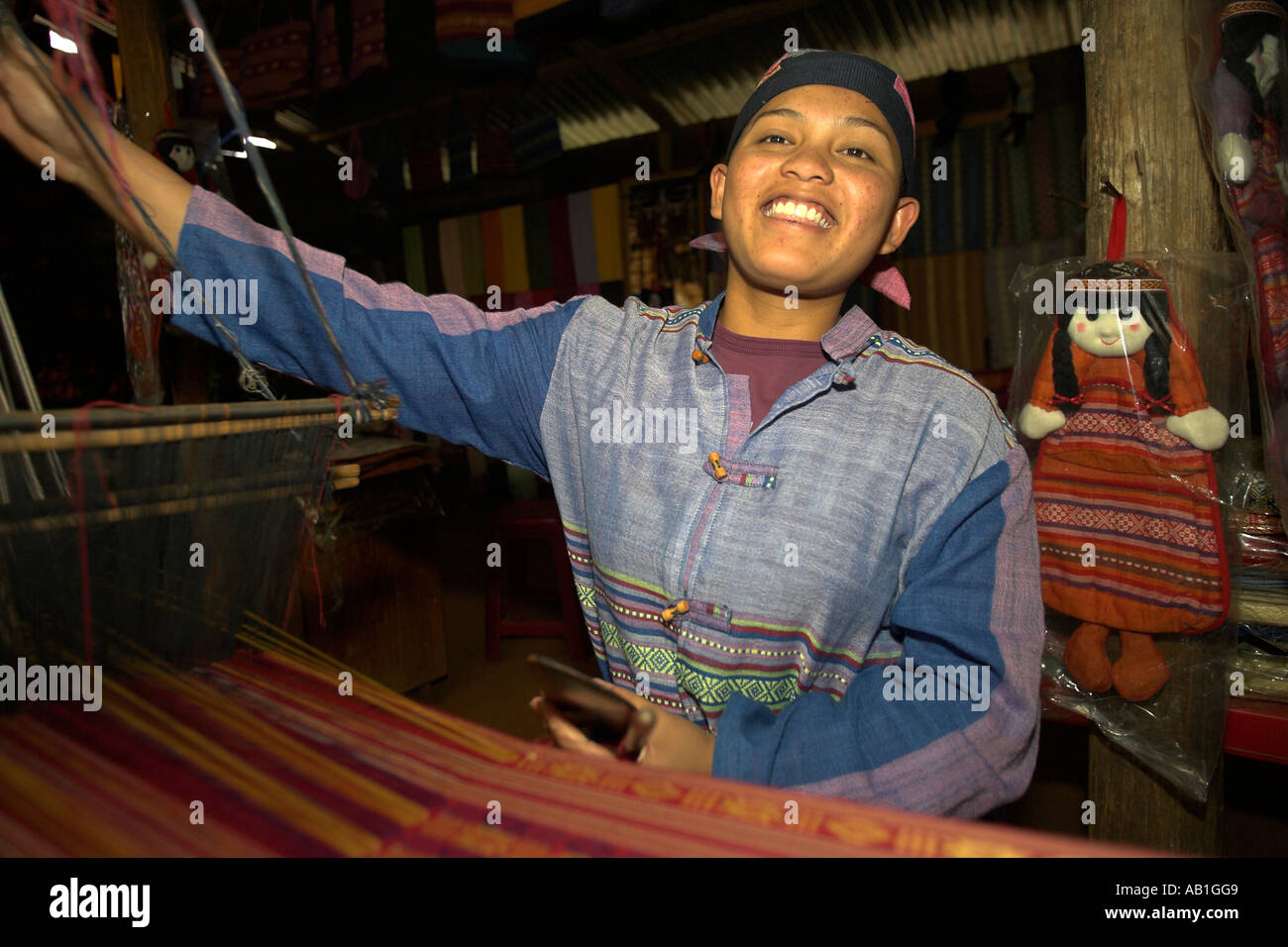 Young Koho woman weaving scarf in minority village Lang Dinh An or ...