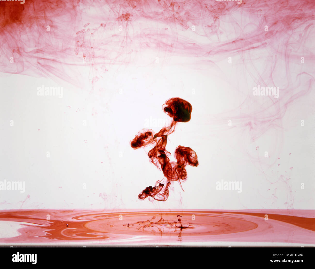 red ink drops in clear water Stock Photo - Alamy
