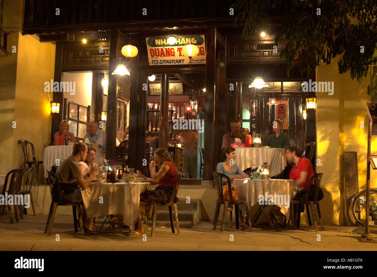 Outdoor restaurants are a popular feature of Hoi An historic town mid ...
