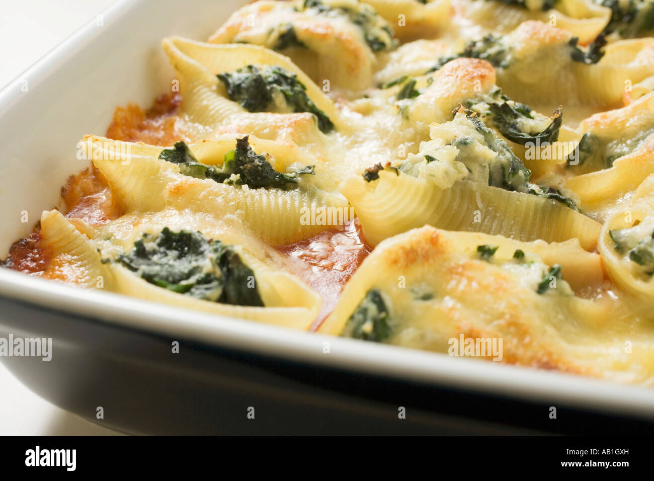 Baked pasta shells with spinach filling FoodCollection Stock Photo - Alamy
