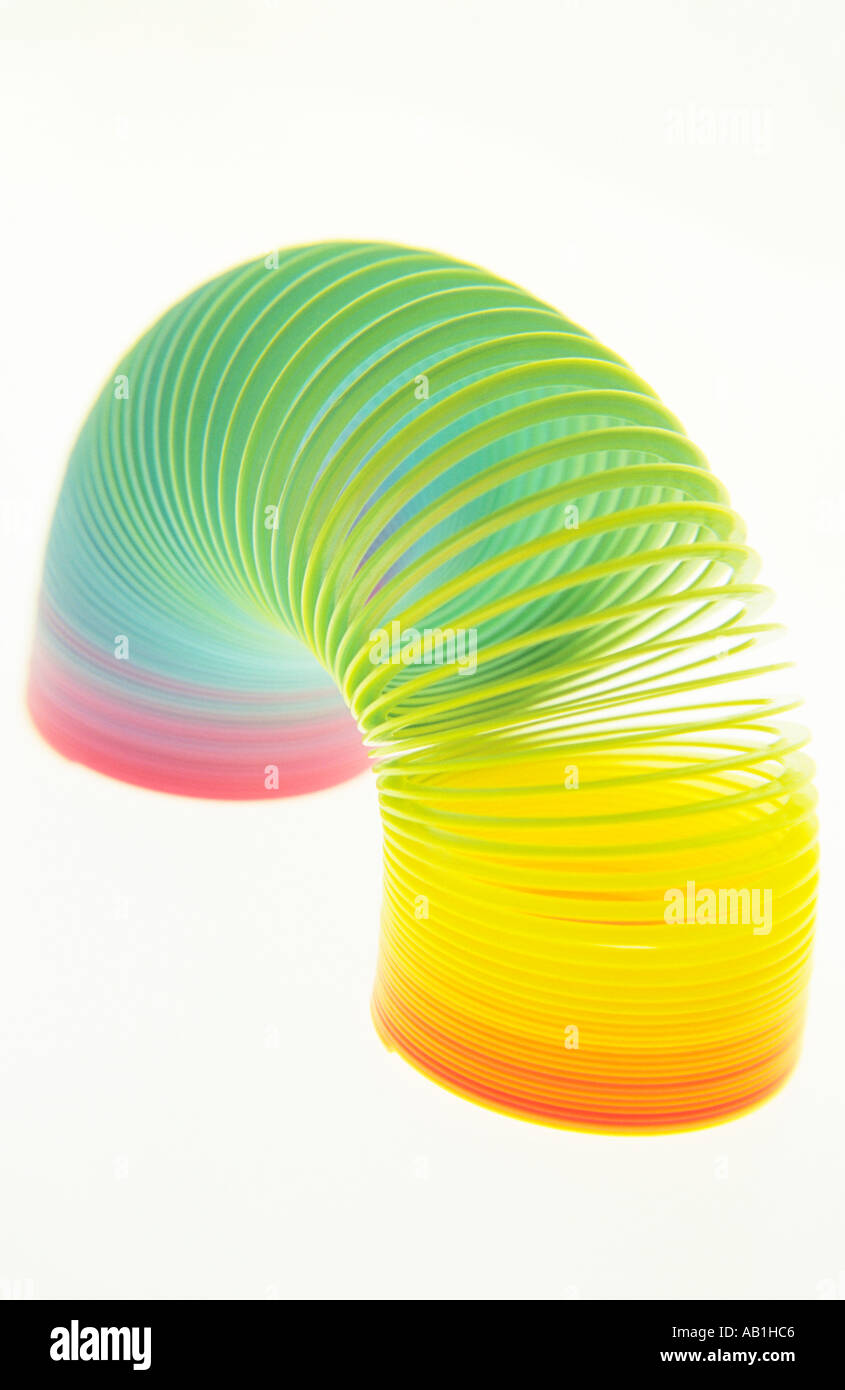 Concept image of toy slinky Stock Photo - Alamy