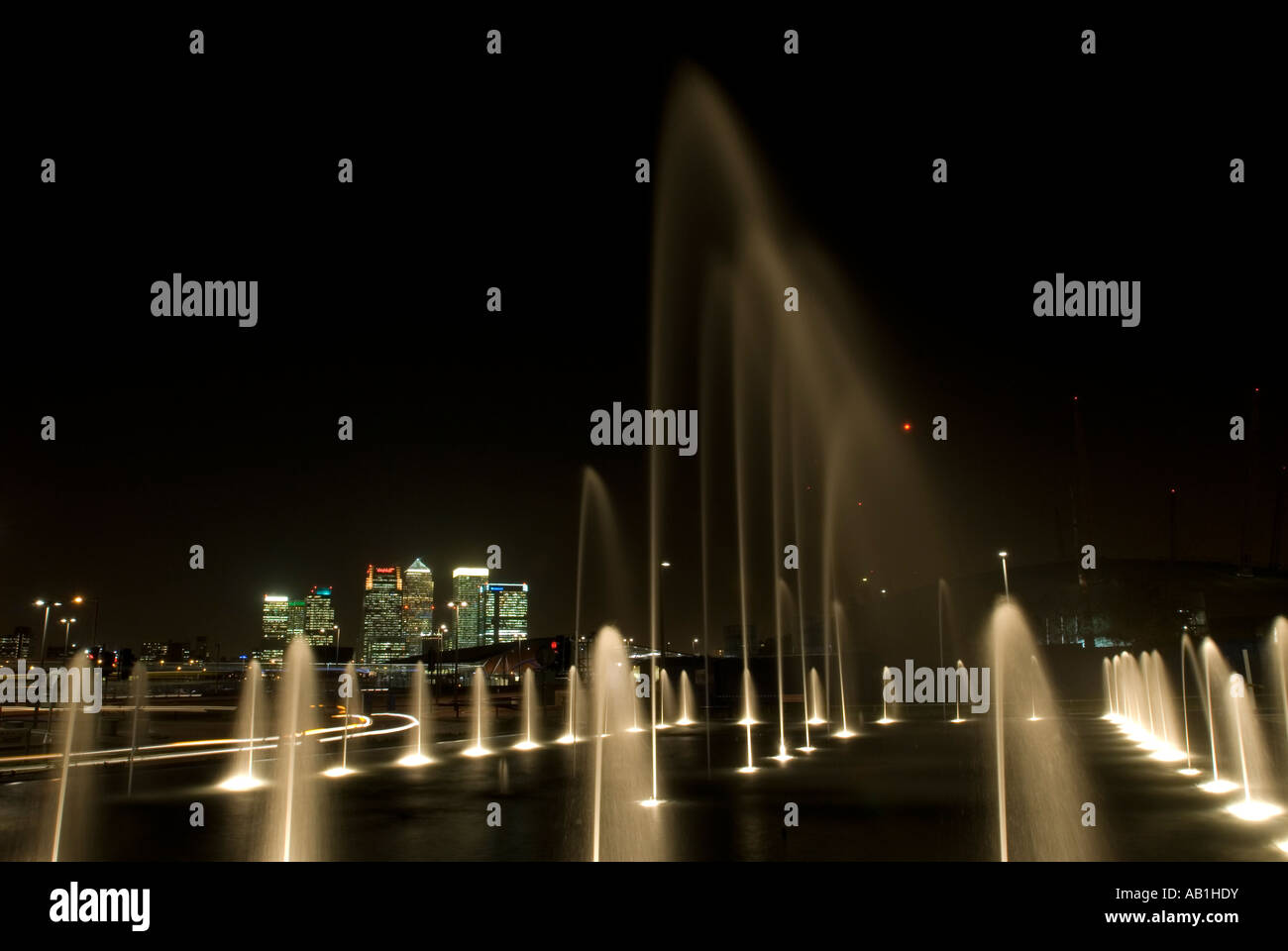 London Docklands at night with lit fountain Stock Photo - Alamy