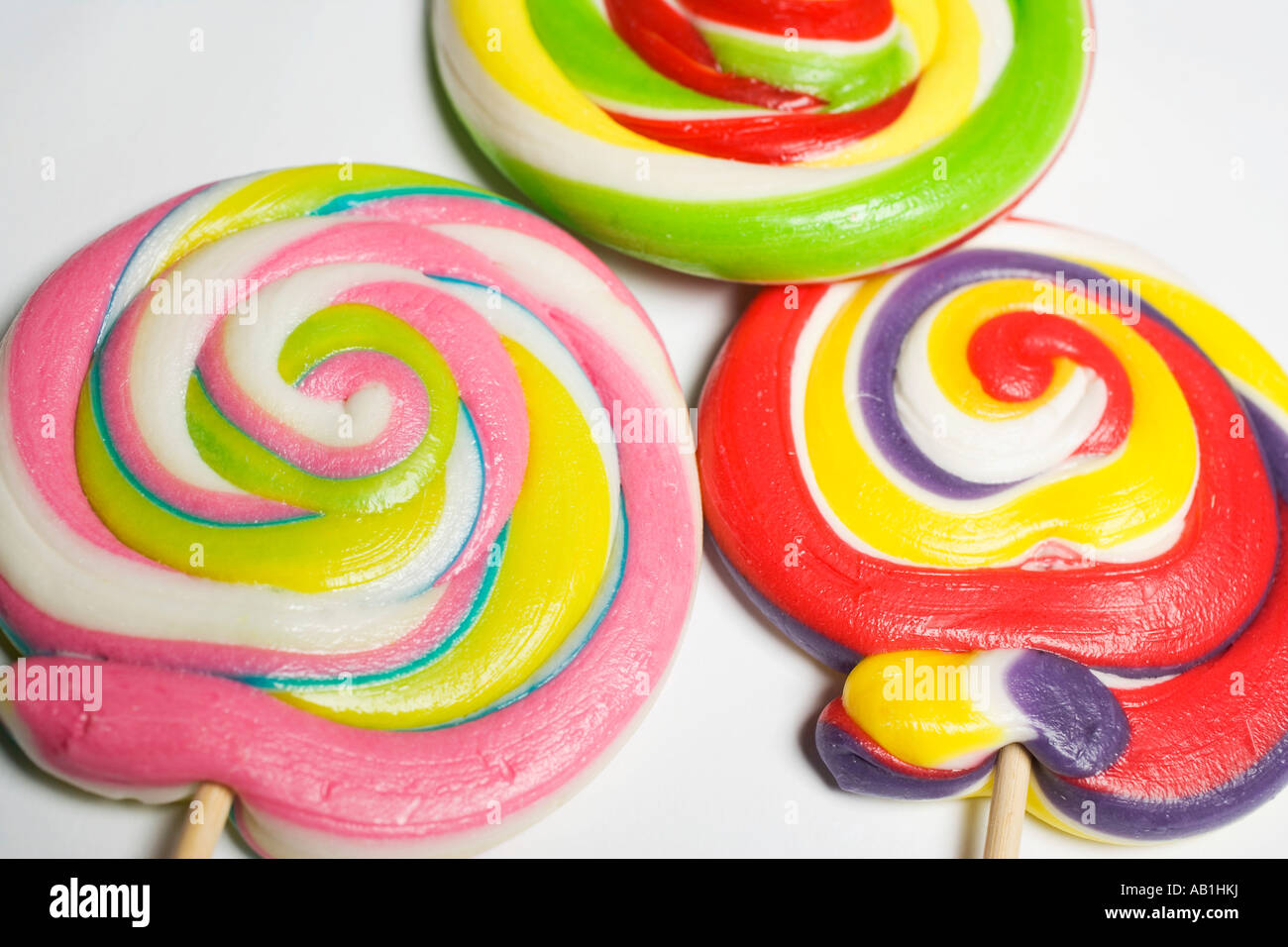 Three coloured lollipops FoodCollection Stock Photo - Alamy