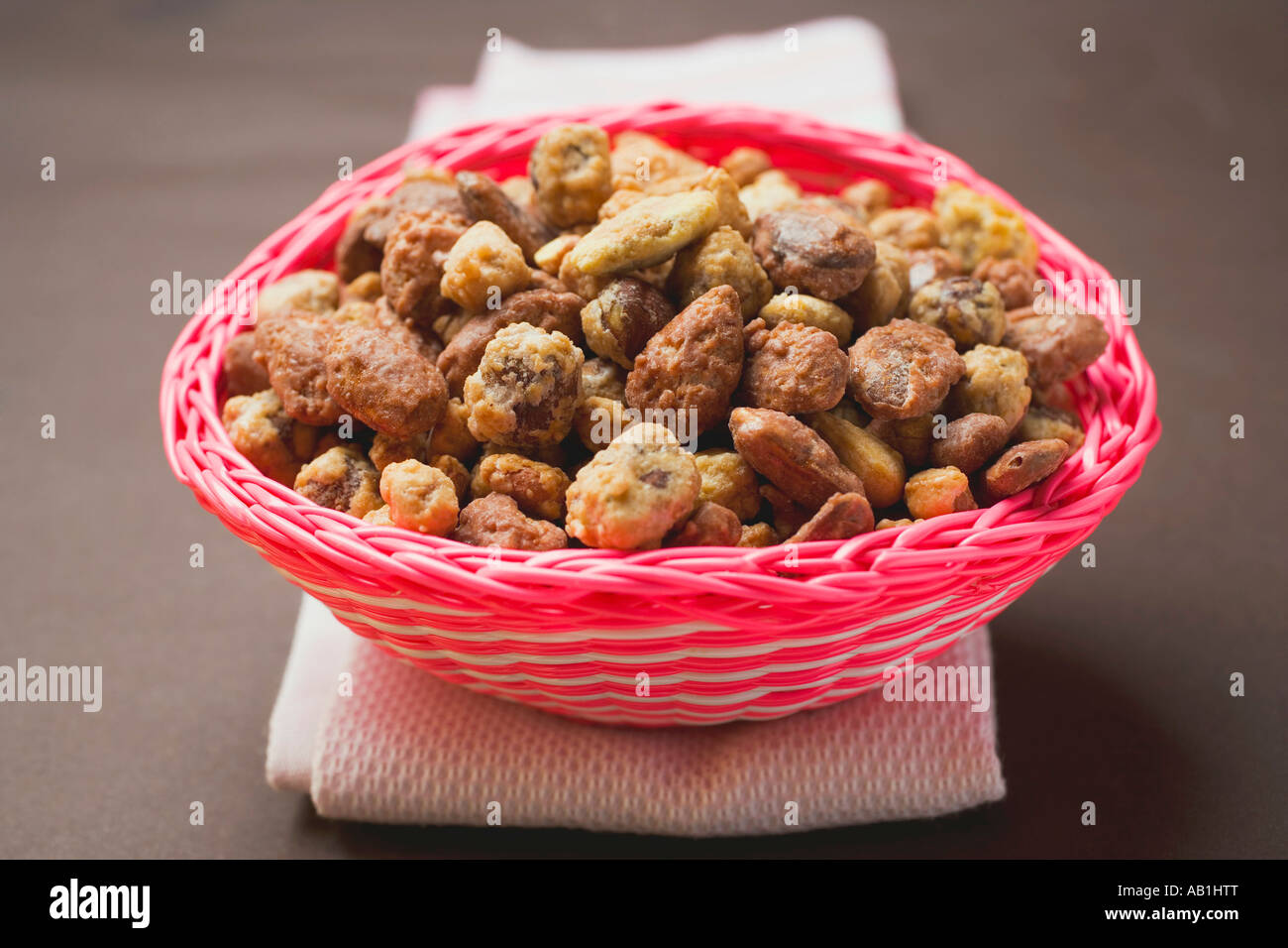 Mixed nuts to nibble in pink basket FoodCollection Stock Photo - Alamy