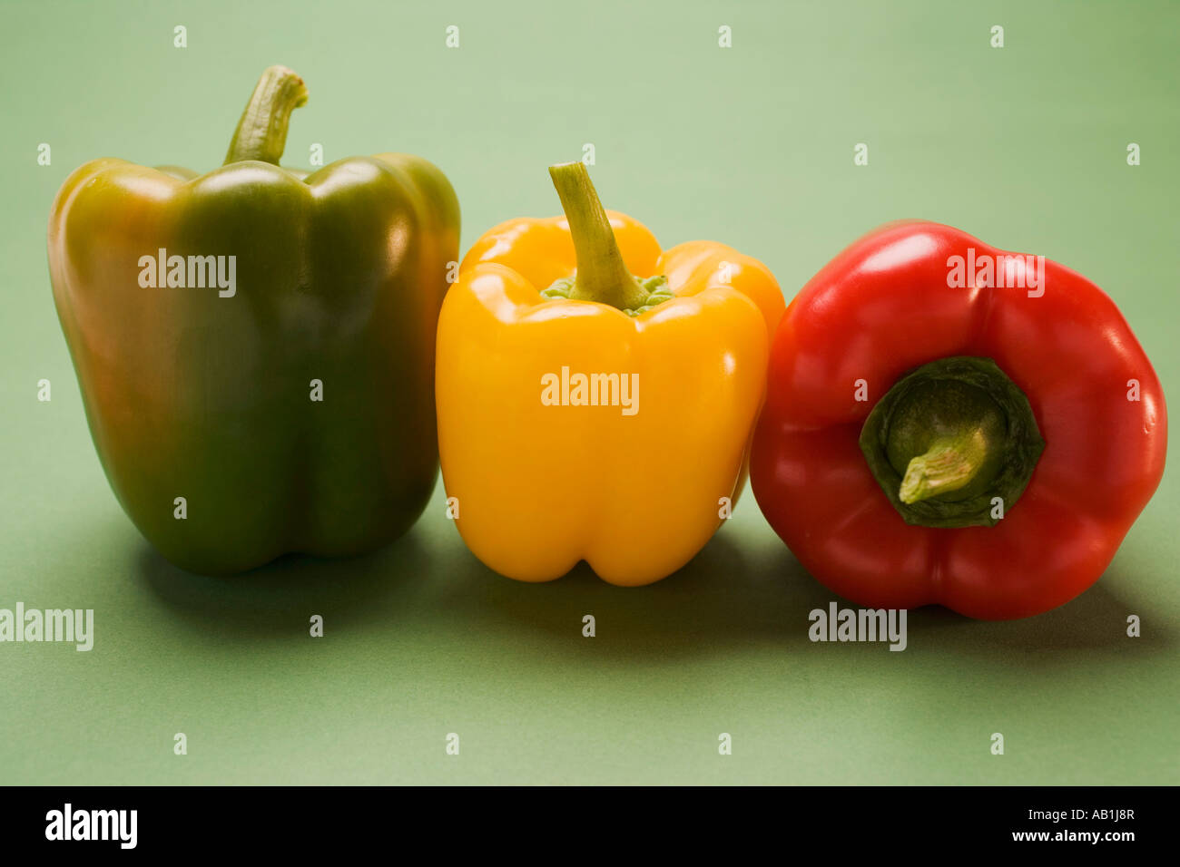 Three peppers yellow red green in a row FoodCollection Stock Photo - Alamy