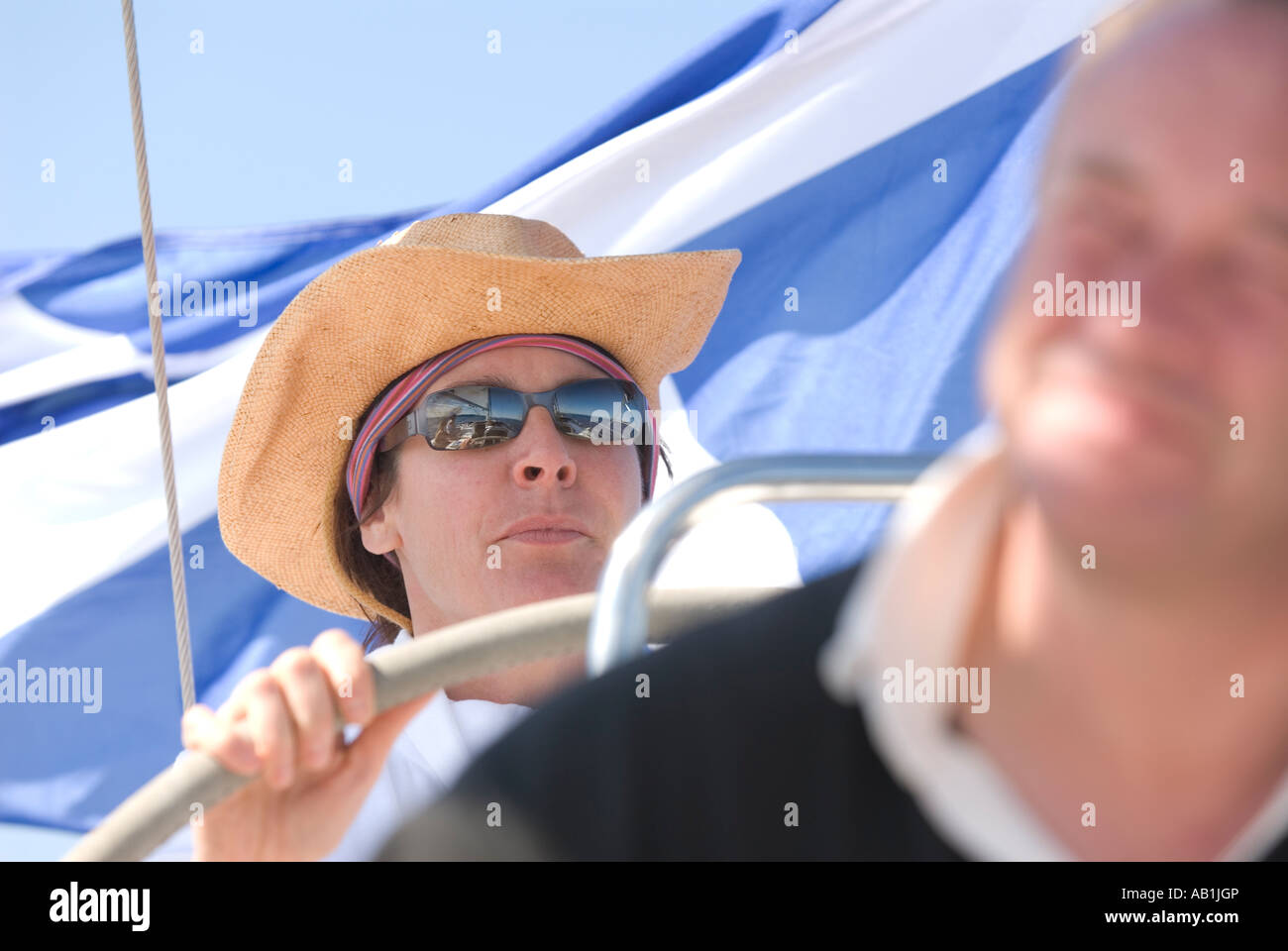 helmsman sailing charter yacht Stock Photo - Alamy