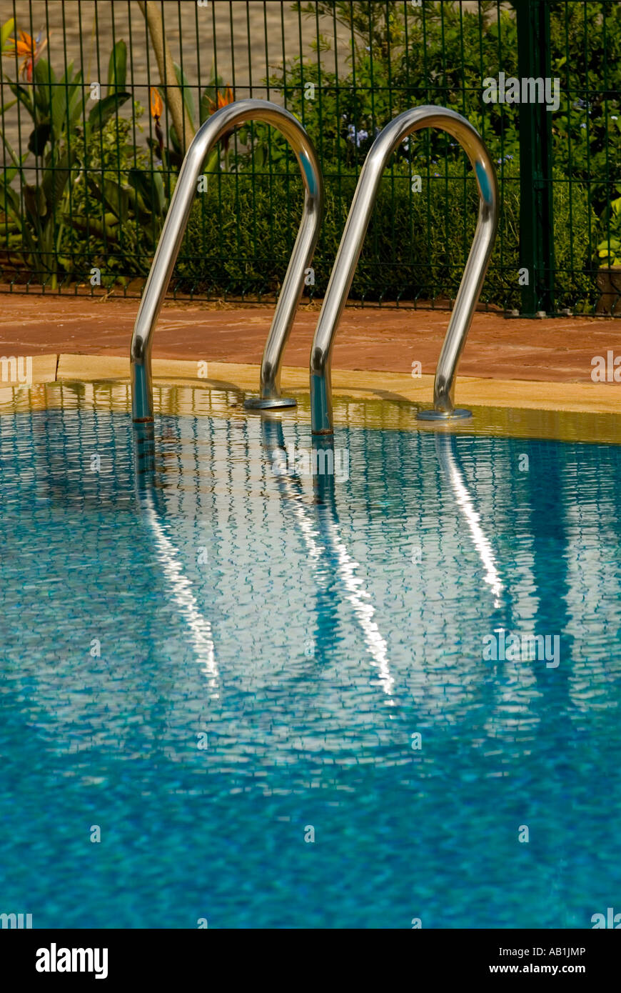 outdoor swimming pool access railings Stock Photo - Alamy