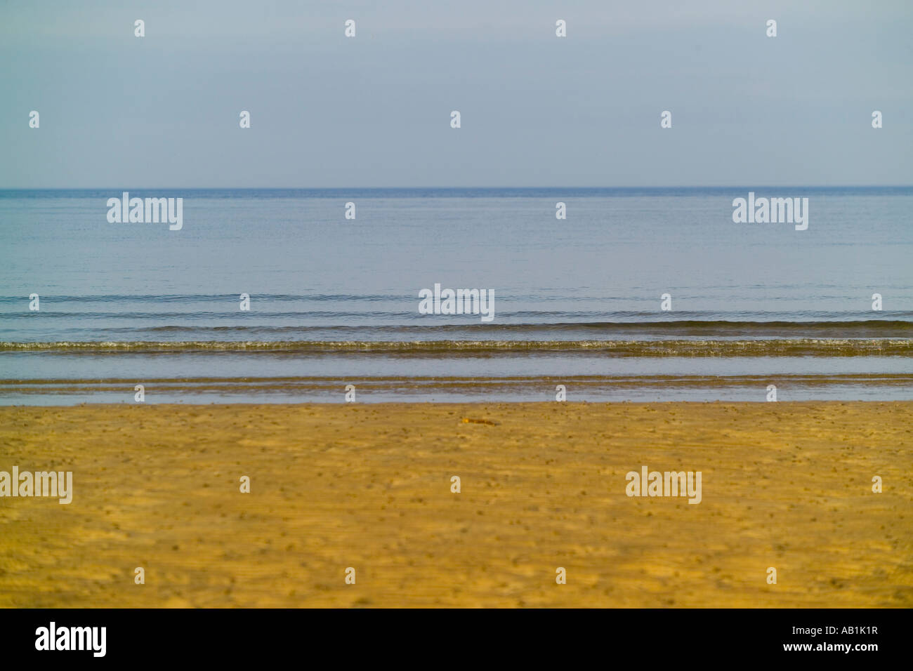 calm sea shore with small wave ripples Stock Photo - Alamy