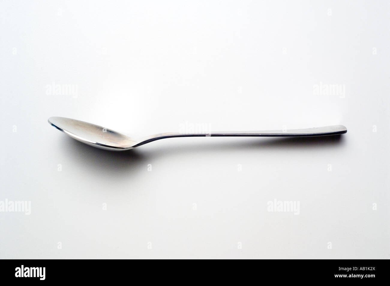 steel spoon profile on white background with drop shadow Stock Photo ...
