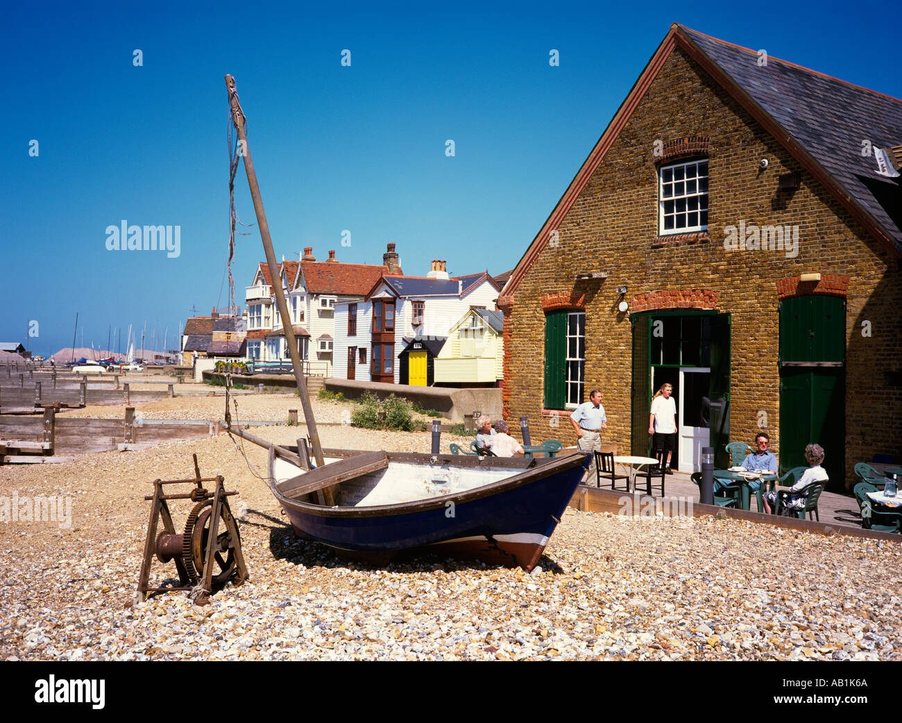 UK Kent Whitstable beach with fishing boat on the shingle Stock Photo ...