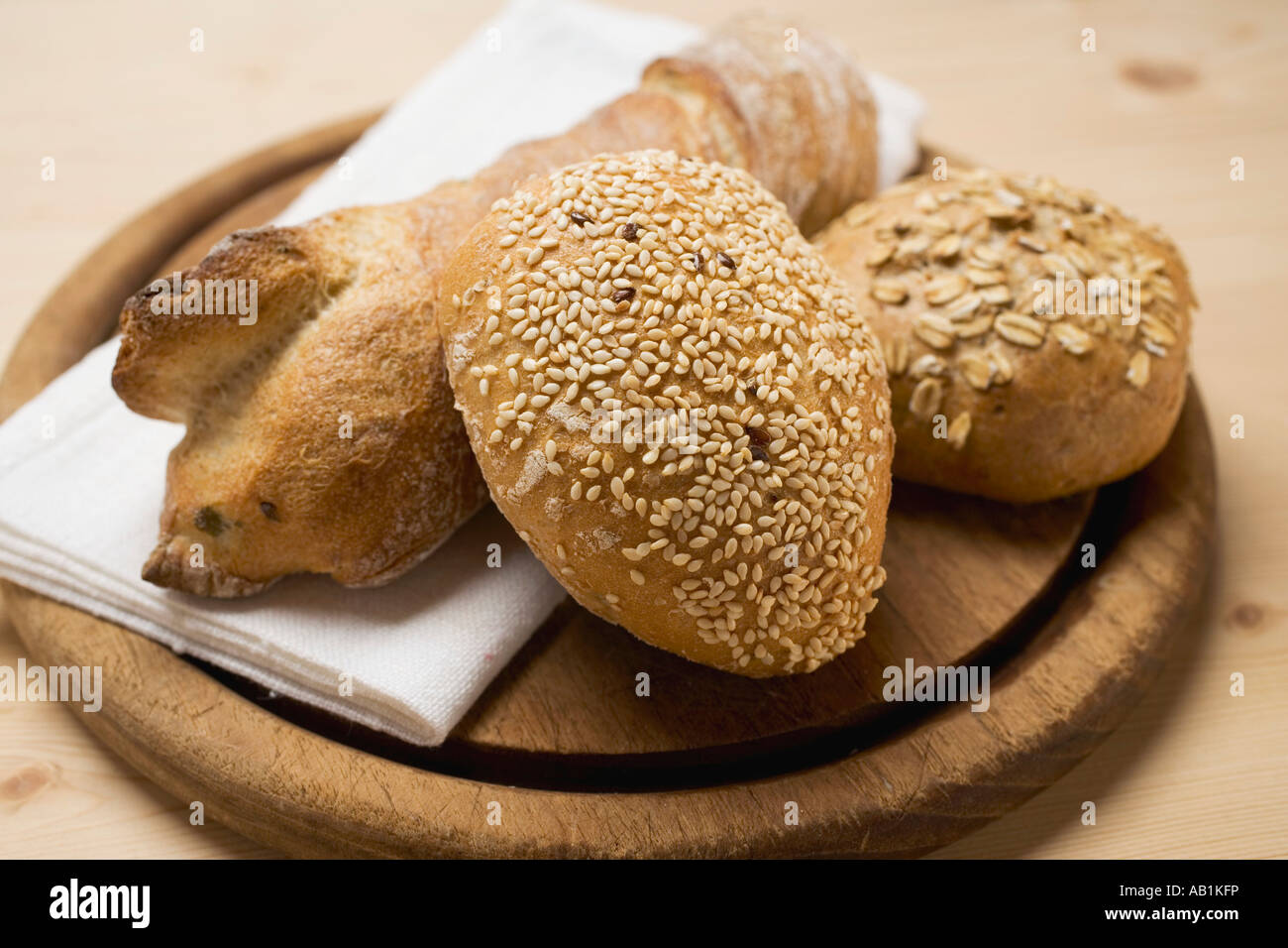 Baguette and wholemeal rolls on breadboard FoodCollection Stock Photo ...