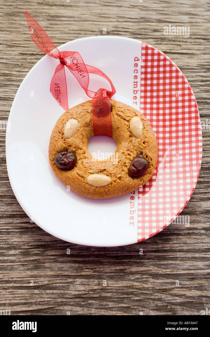 Ring shaped gingerbread tree ornament on plate FoodCollection Stock ...