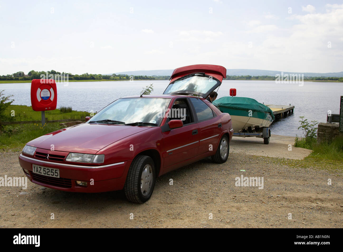 red citroen car and speed boat preparing to launch at corradillar ...