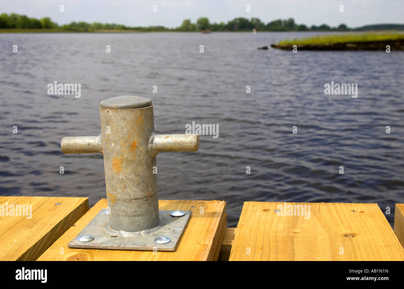 close up of new metal boat mooring post attached to corradillar jetty ...