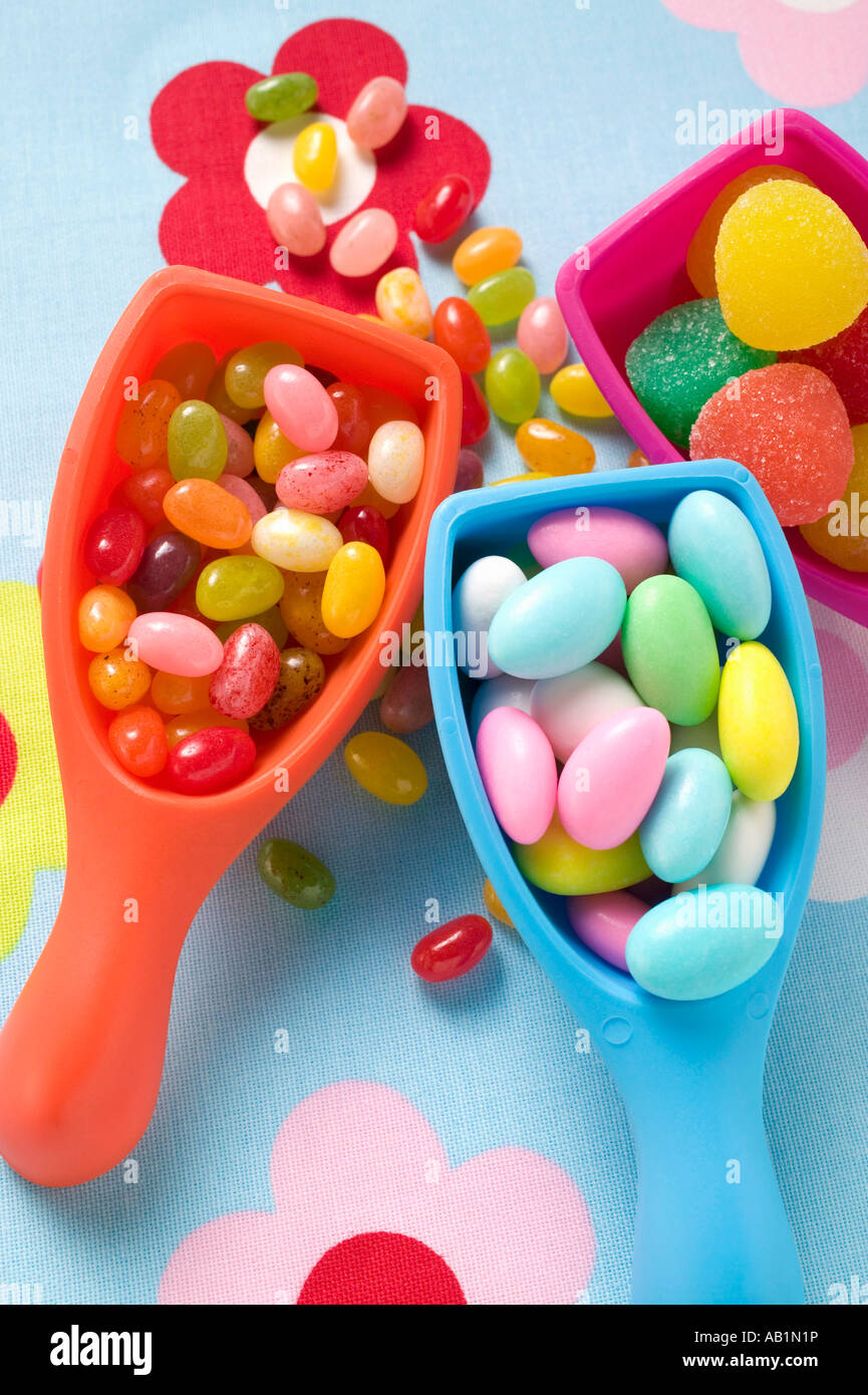 Assorted coloured sweets in plastic scoops FoodCollection Stock Photo ...