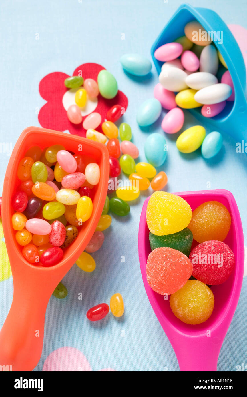 Assorted coloured sweets in plastic scoops FoodCollection Stock Photo ...