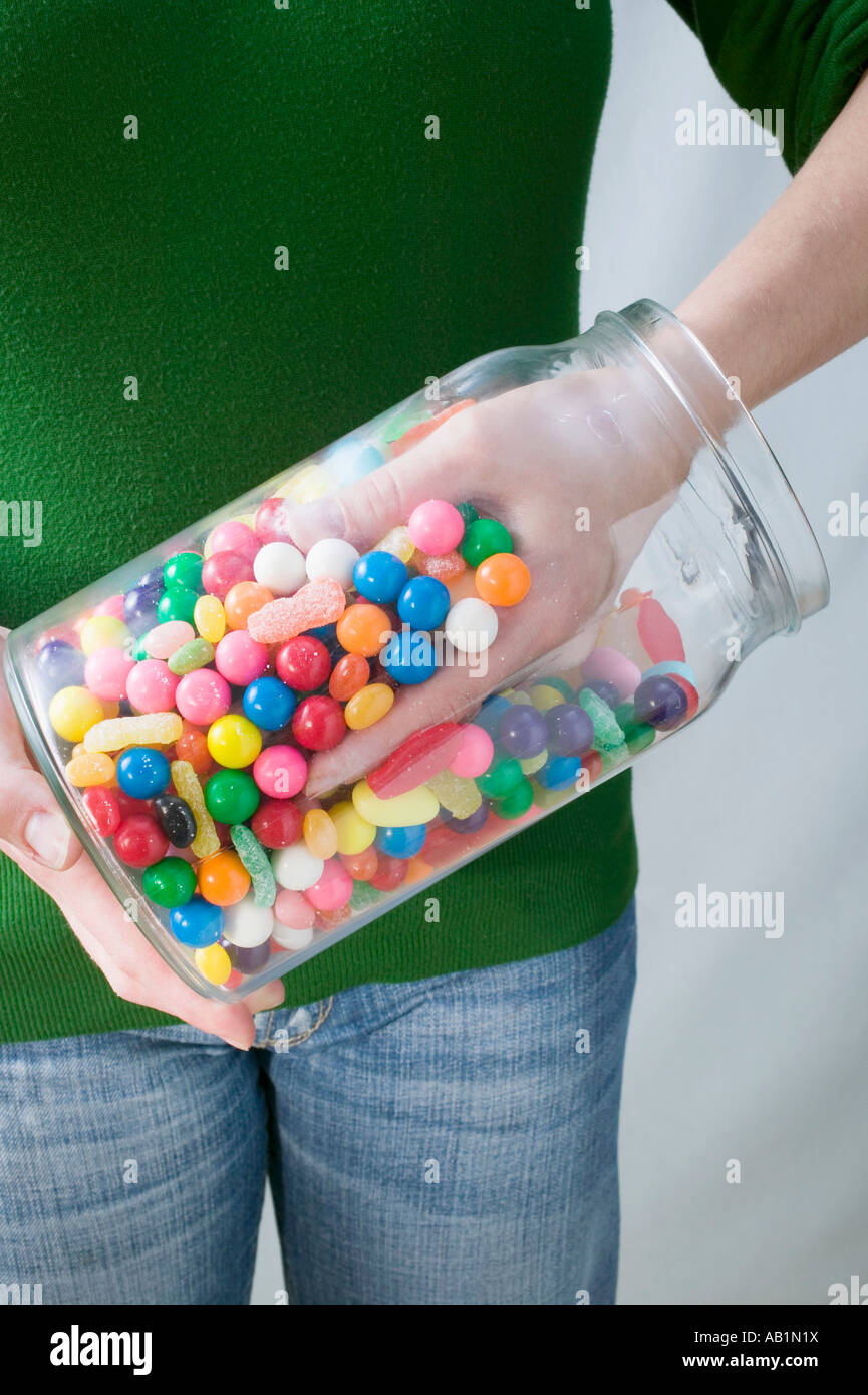 Hand taking bubble gum out of jar FoodCollection Stock Photo - Alamy