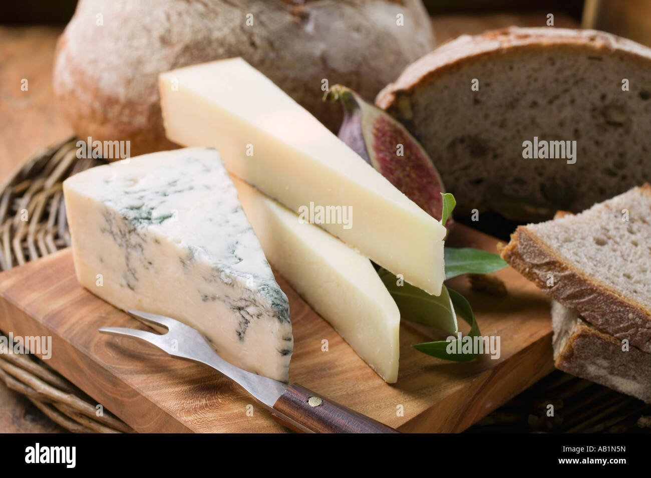 Various types of cheese bread and half a fig FoodCollection Stock Photo ...