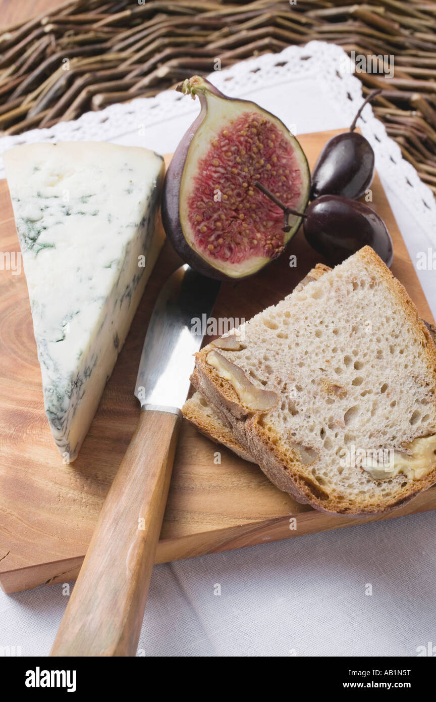 Piece of blue cheese half a fig olives and bread FoodCollection Stock ...