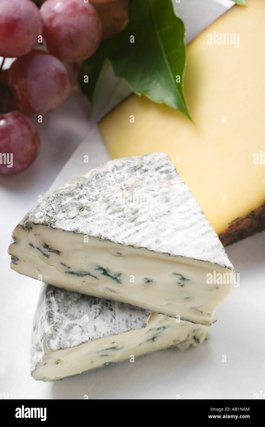 Two different types of cheese and red grapes FoodCollection Stock Photo ...