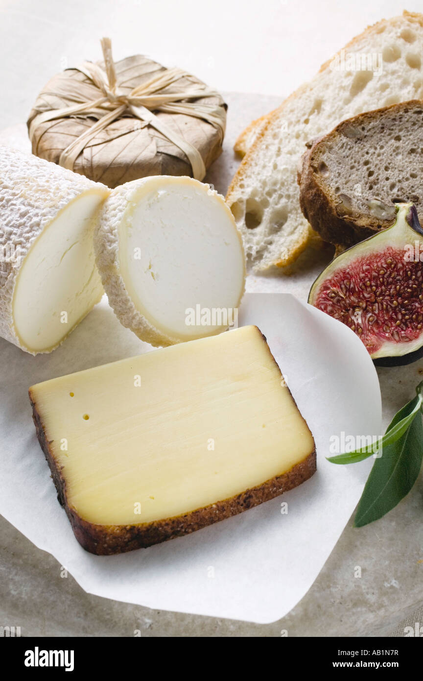 Cheese still life with bread and half a fig FoodCollection Stock Photo ...