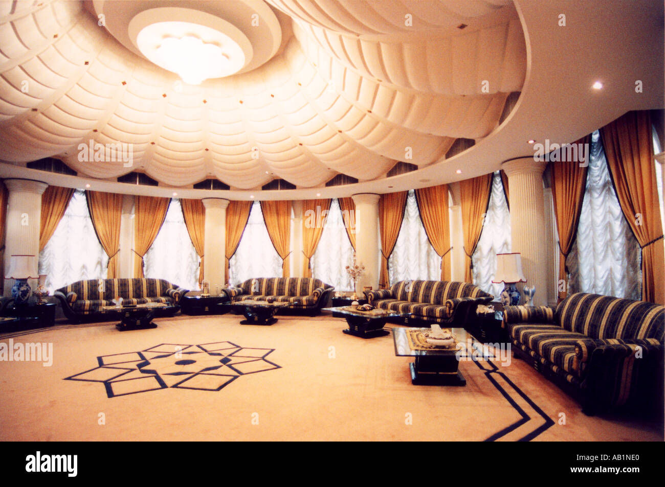 Rich Dubai lounge in a private house many guest sofas round room with a ...