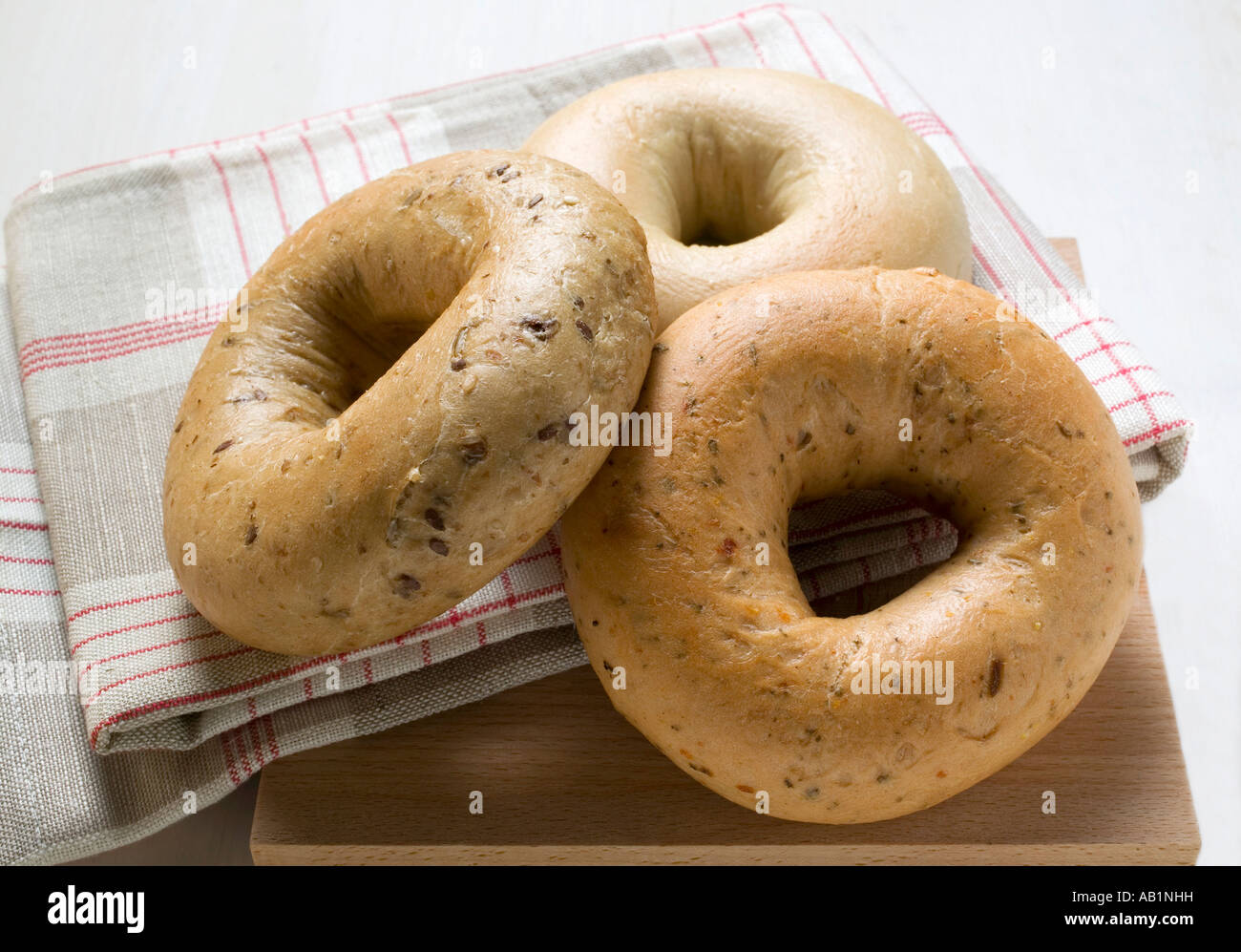 Three different bagels on tea towel FoodCollection Stock Photo - Alamy