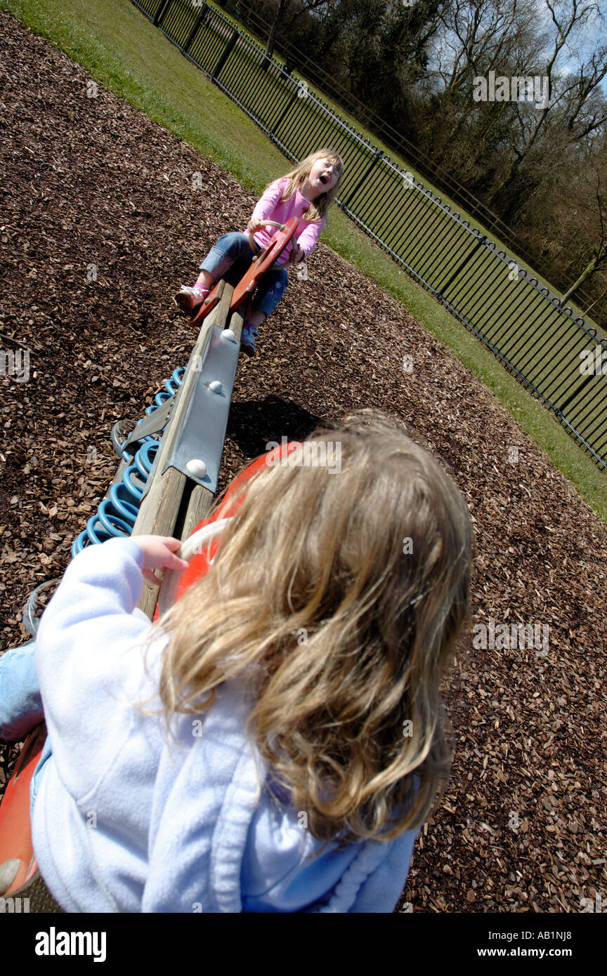 Children on seesaw Stock Photo - Alamy