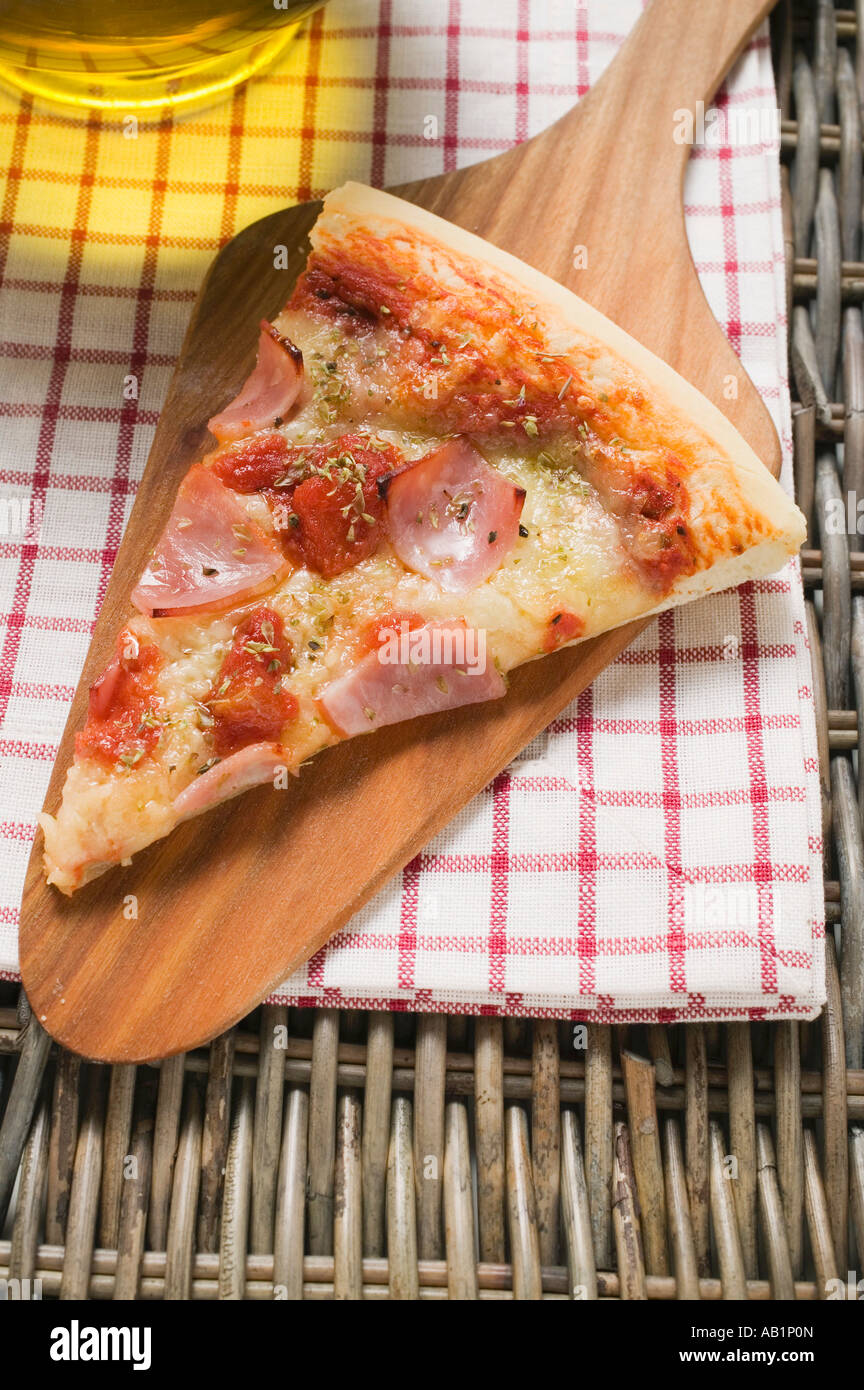 Slice of ham pizza on server FoodCollection Stock Photo - Alamy