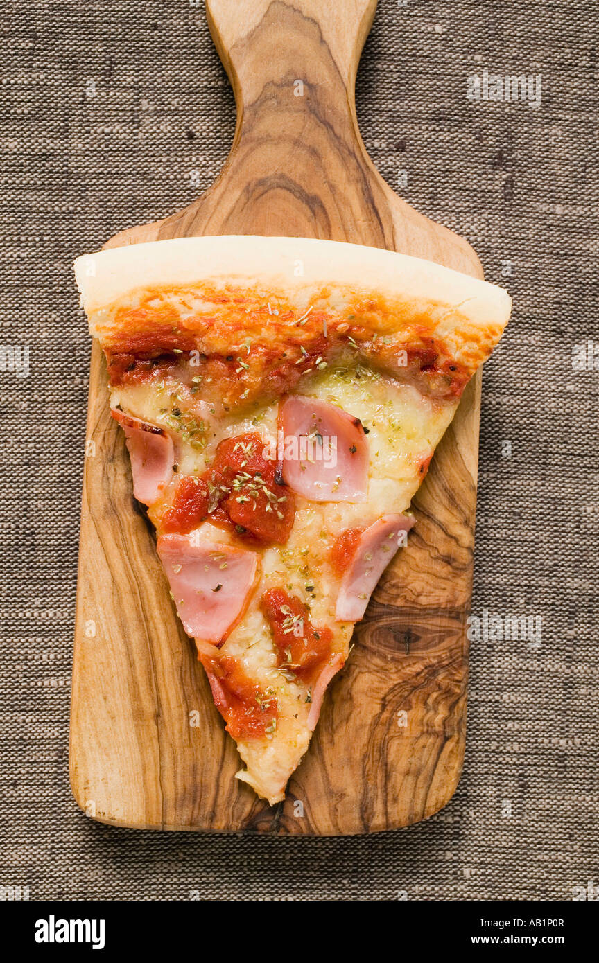 Slice of ham pizza on server FoodCollection Stock Photo - Alamy