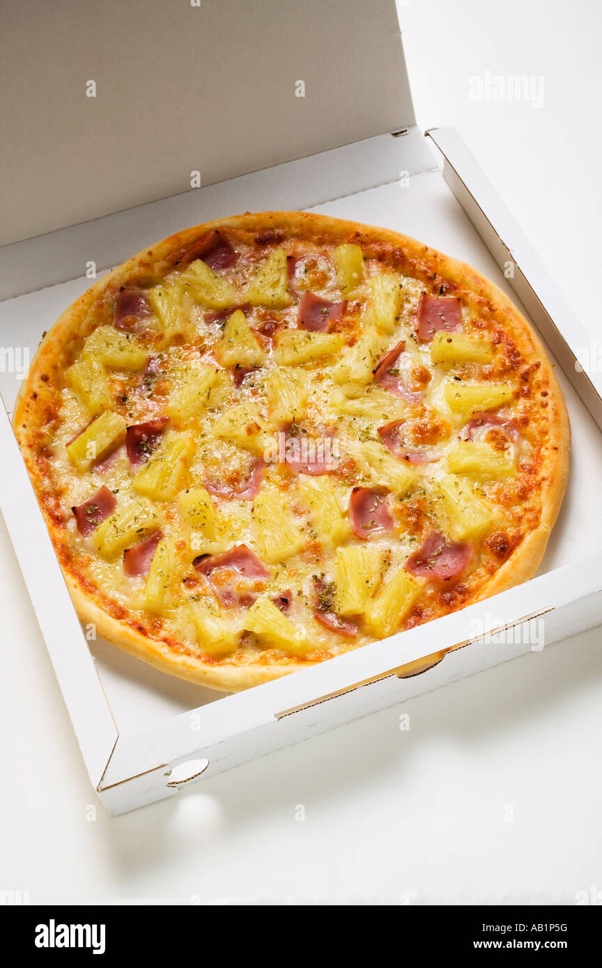 Hawaiian pizza with ham and pineapple in pizza box FoodCollection Stock ...