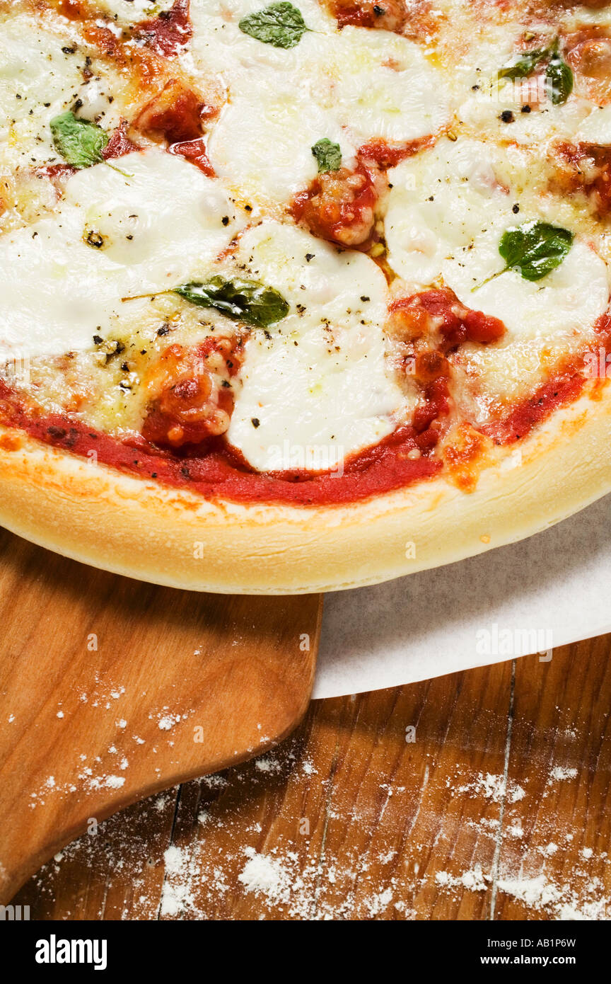 Mozzarella pizza on server detail FoodCollection Stock Photo - Alamy