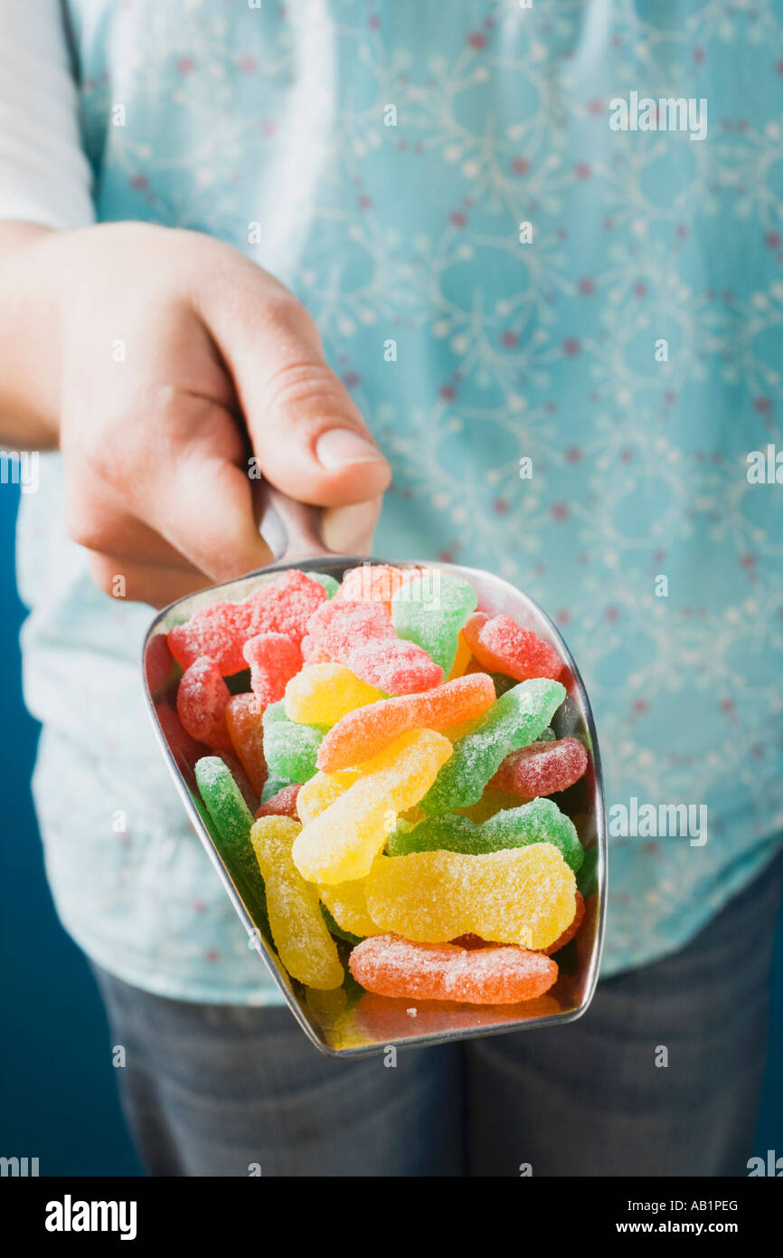 Hand full of sweets hi-res stock photography and images - Alamy